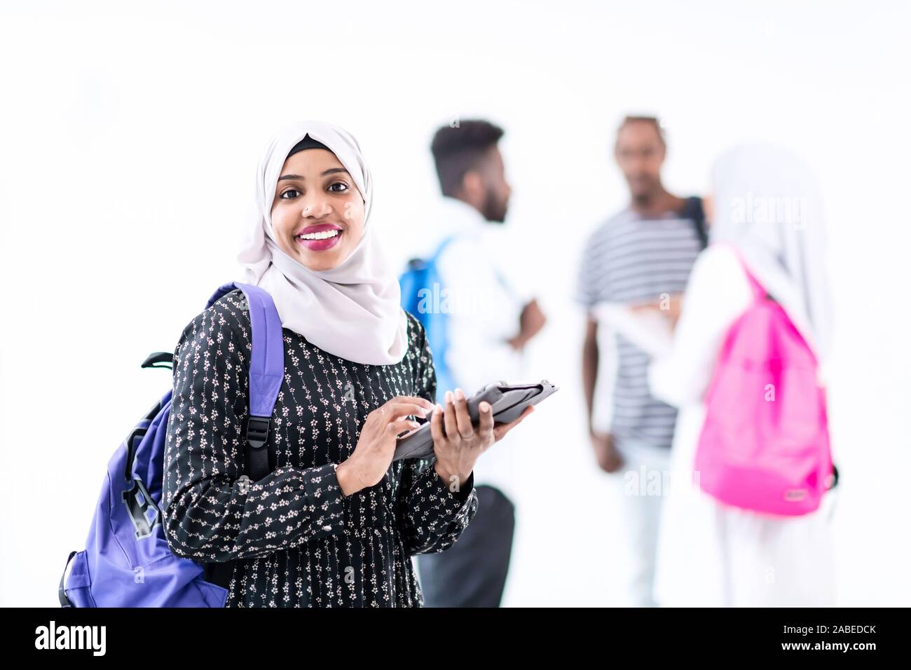 young modern muslim african female student using tablet computer with ...