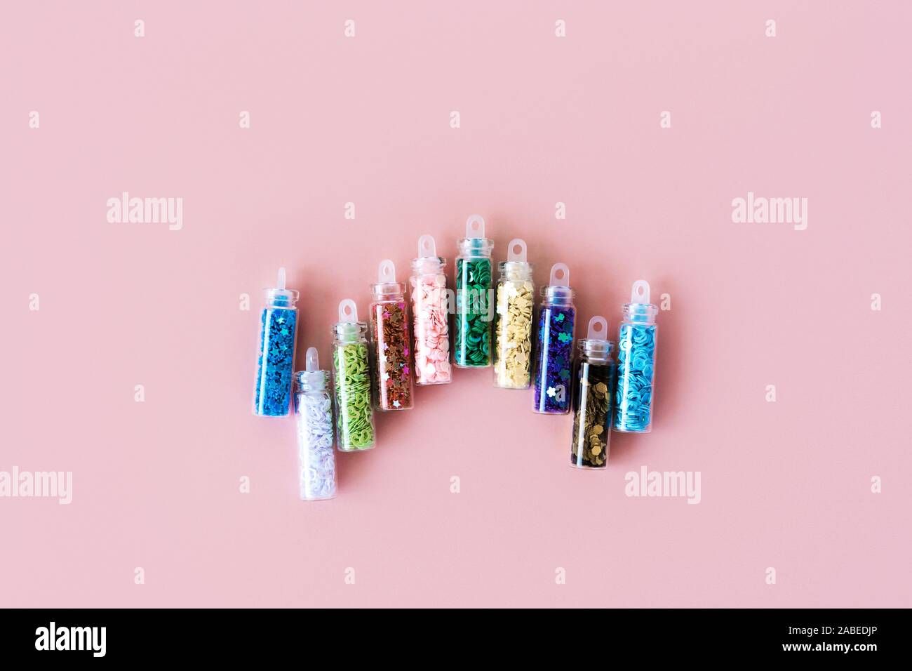 Soft pastel pink background box set sparkles and sequins of different ...