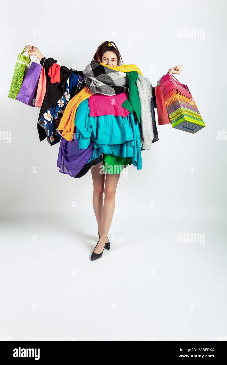 Shopping like an issue. Woman addicted of sales. Overproduction and crazy demand. Female model ...