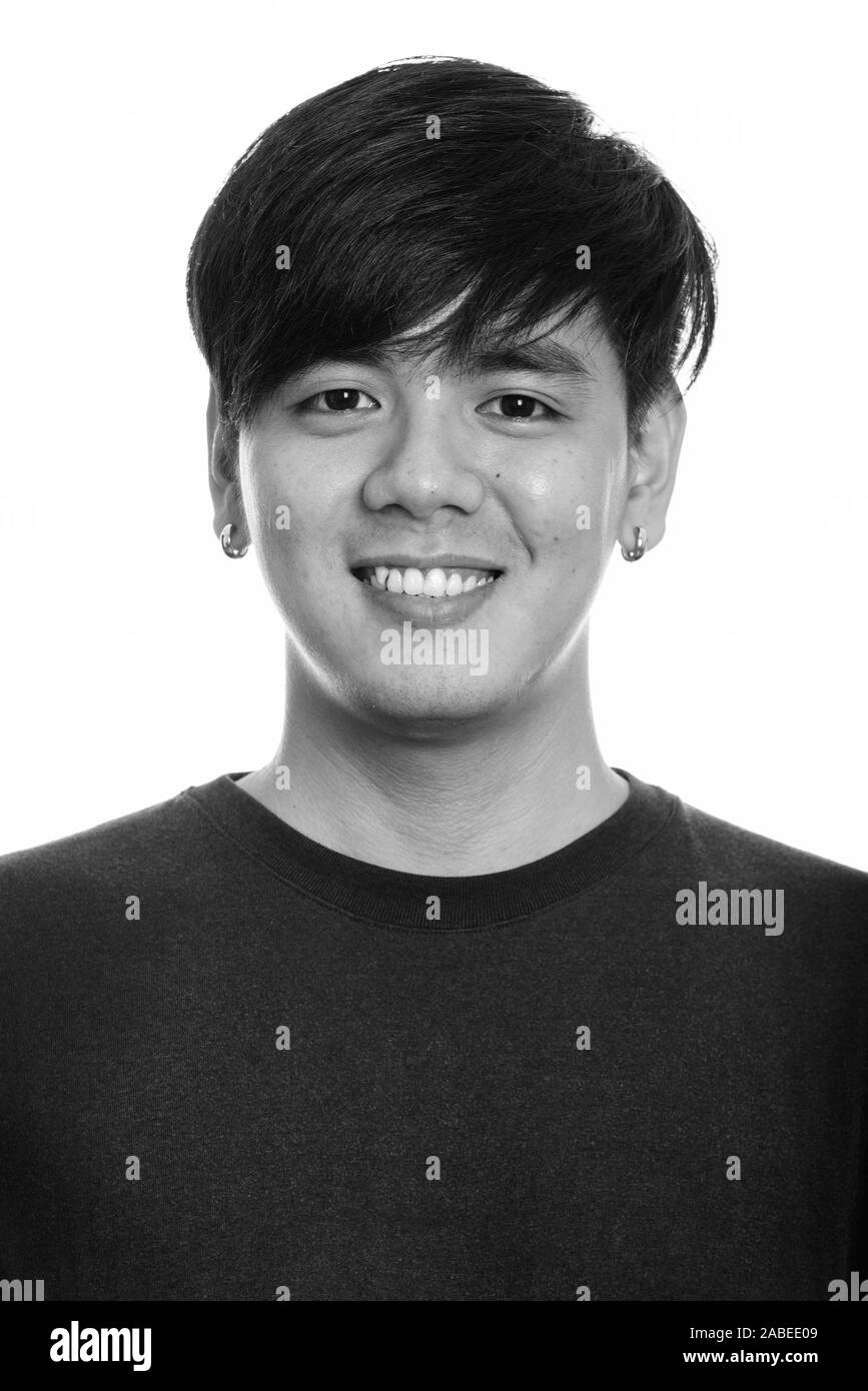 Face of young happy Asian man smiling Stock Photo - Alamy