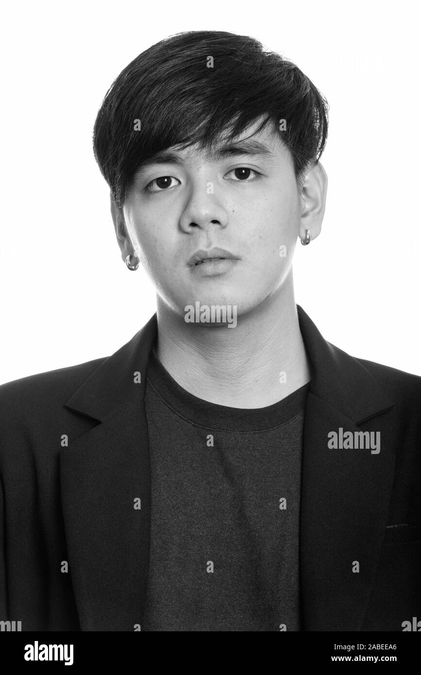 Face of young handsome Asian businessman in black and white Stock Photo ...