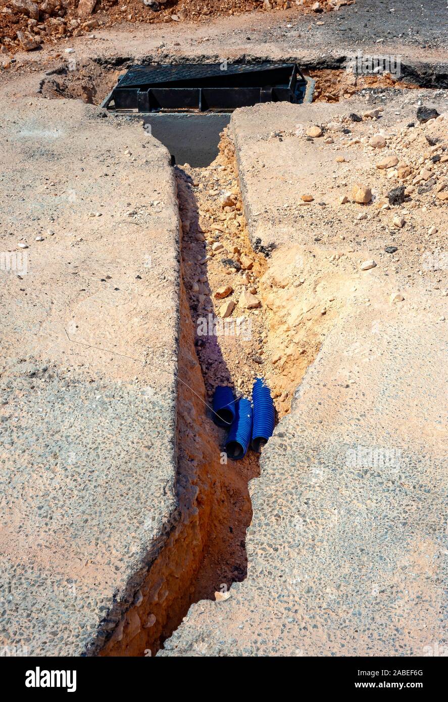 digging a restricted section for buried corrugated plastic conduits to ...