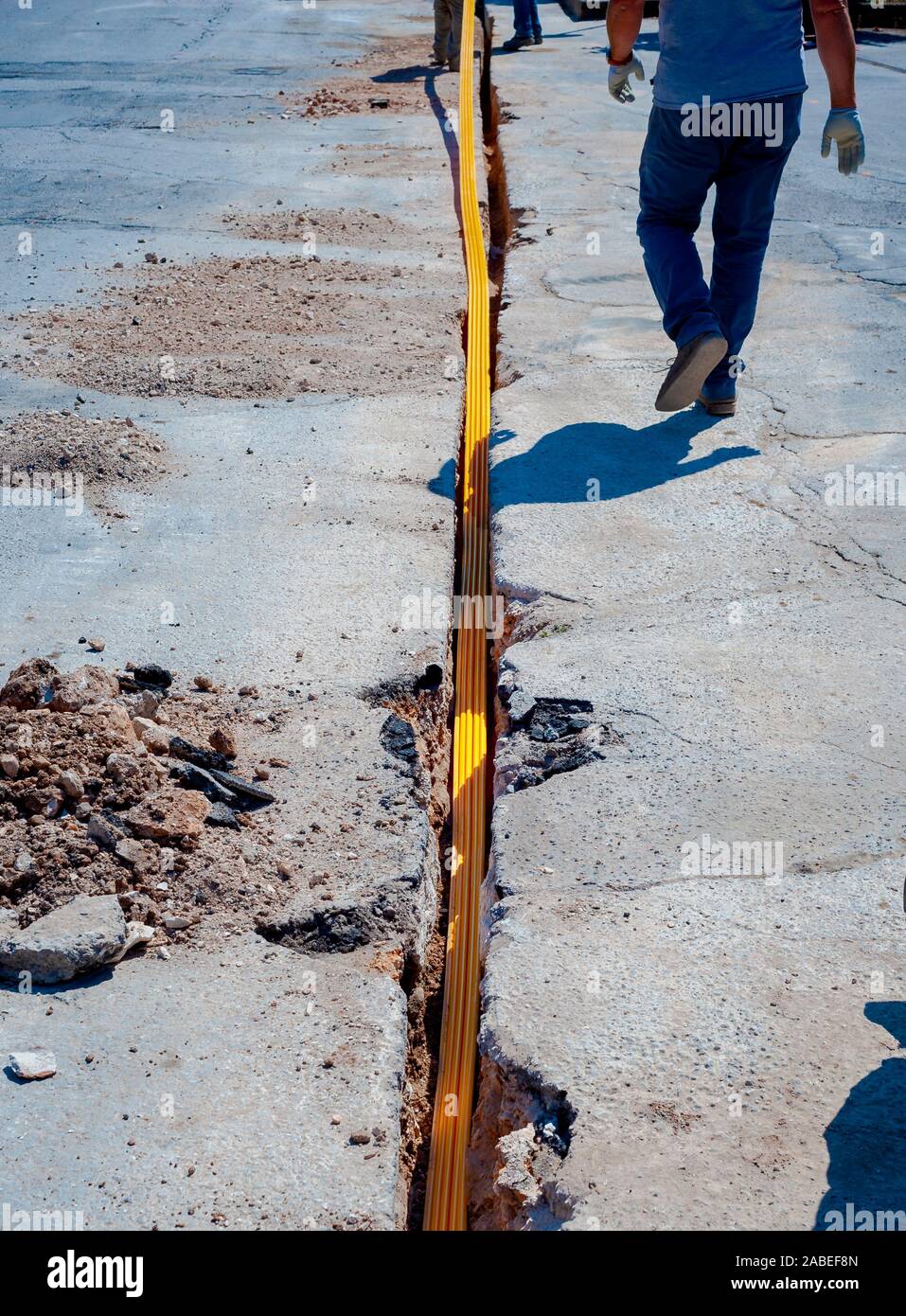 digging a restricted section for buried corrugated plastic conduits to ...