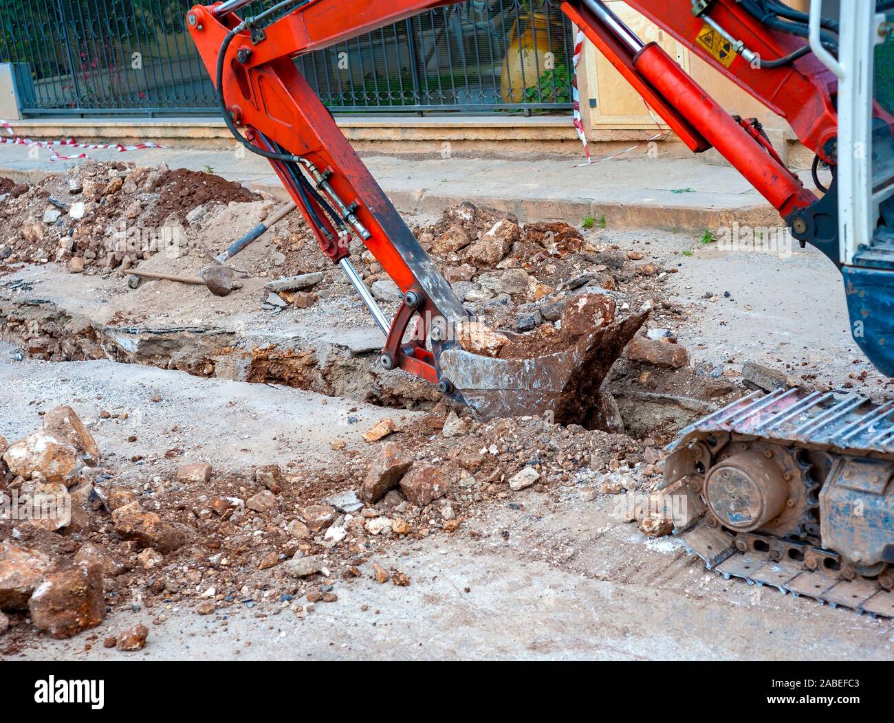 excavation with a narrow section to bury corrugated plastic cable ducts ...