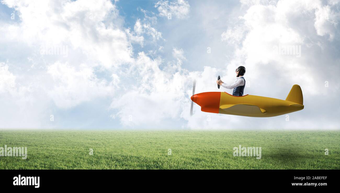 Happy aviator driving small propeller plane Stock Photo - Alamy
