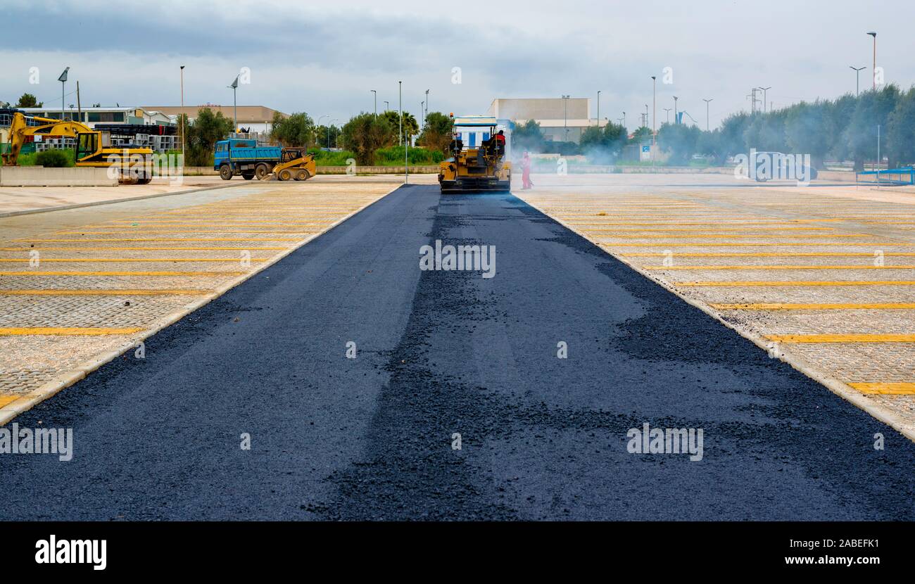 Asphalt paver with asphalt heated to temperatures above 160 ° during ...