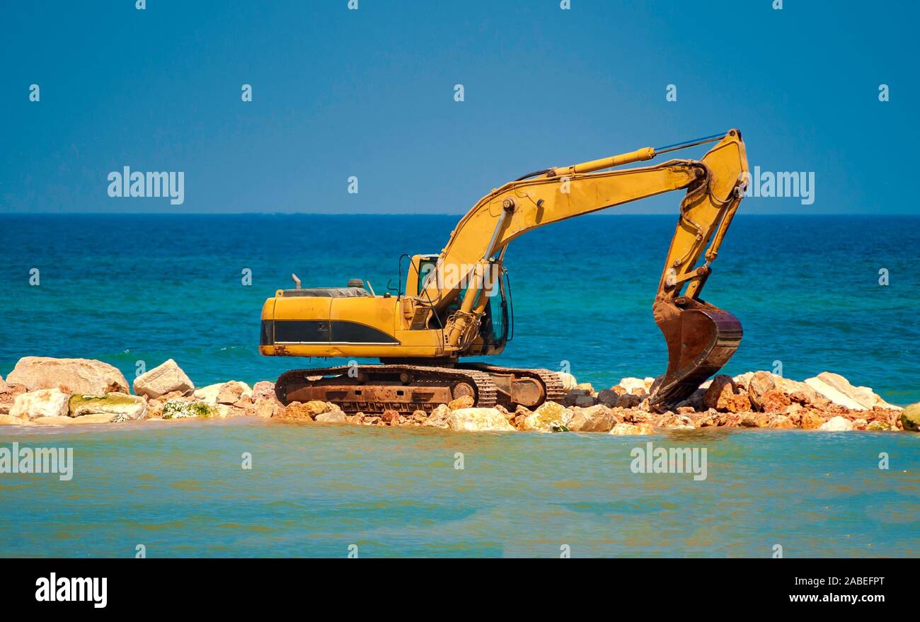 construction equipment on the shore, the construction of breakwaters ...