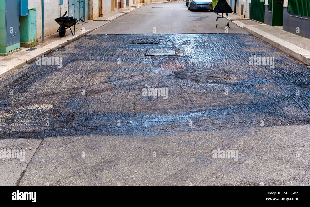 bituminous emulsion sprayed on the surface before starting the laying ...