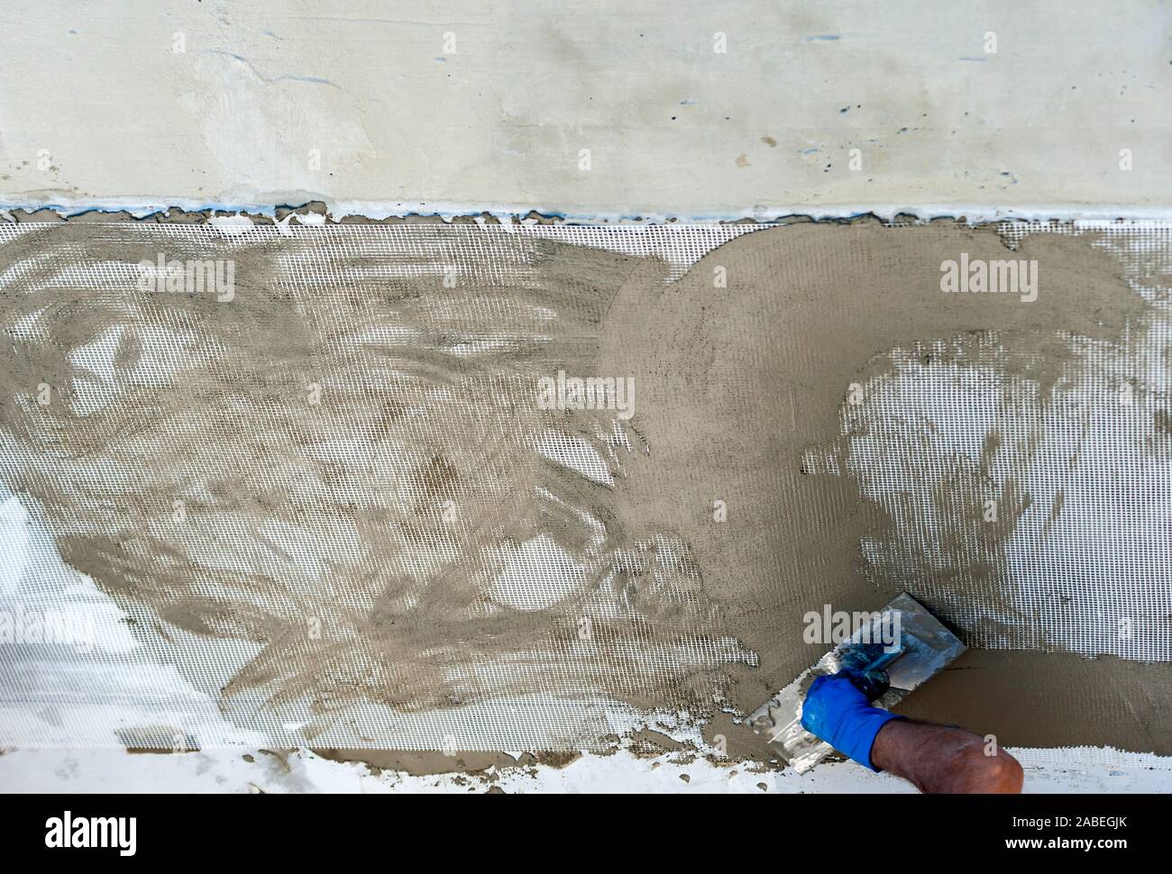 Hand using trowel on fresh concrete in construction site Stock Photo ...