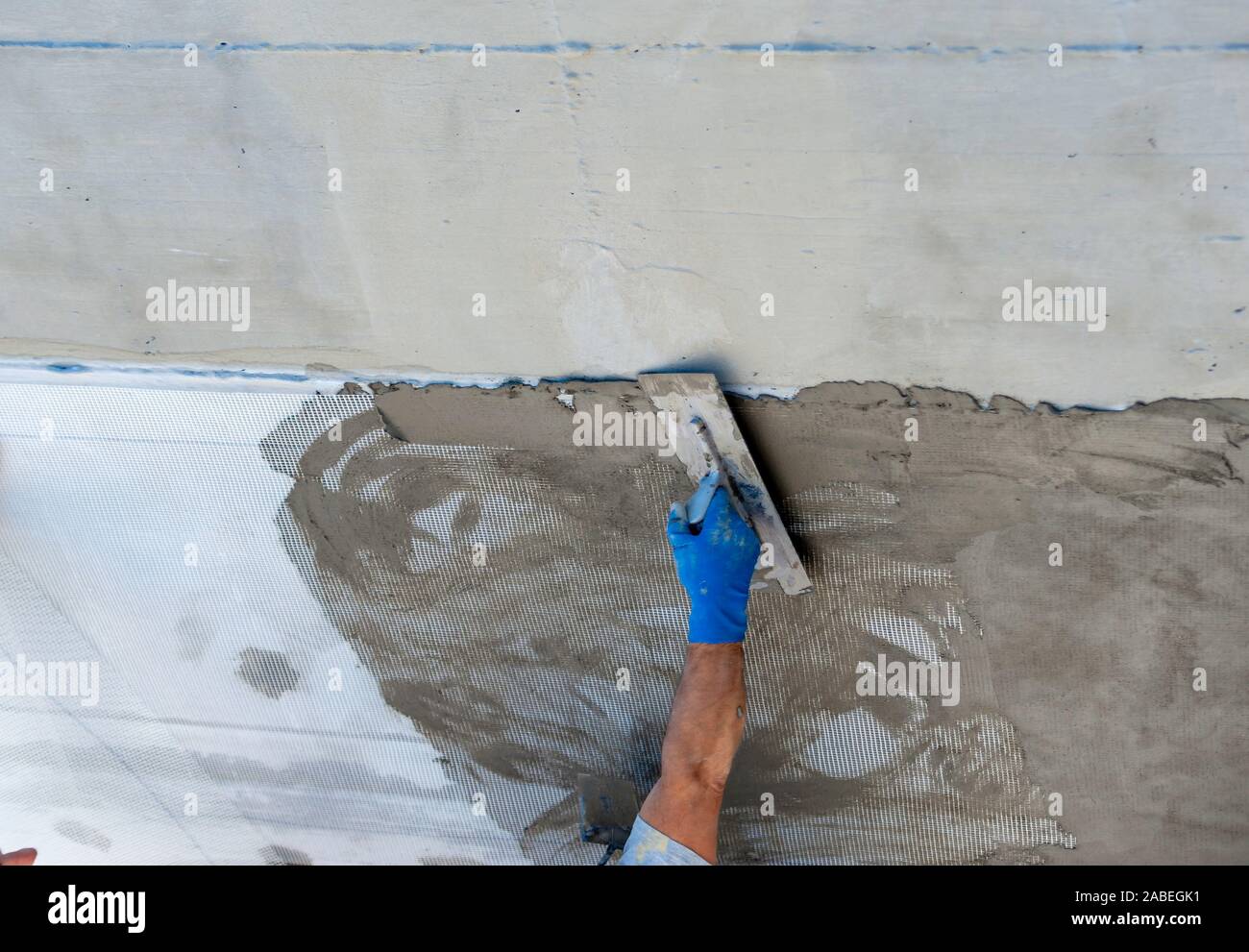 Hand using trowel on fresh concrete in construction site Stock Photo ...