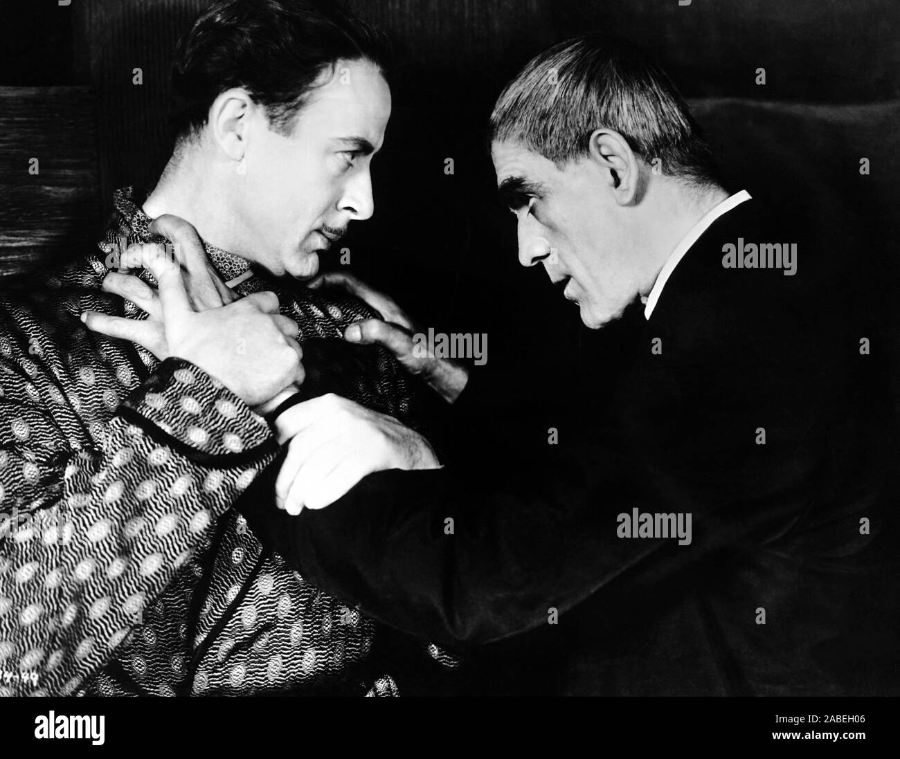 THE RAVEN, from left, Lester Matthews, Boris Karloff, 1935 Stock Photo ...