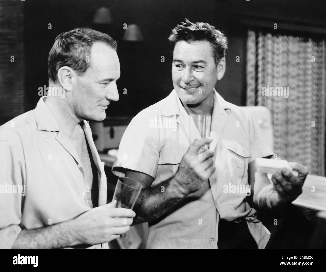 THE ROOTS OF HEAVEN, from left: Trevor Howard, Errol Flynn, 1958. TM ...