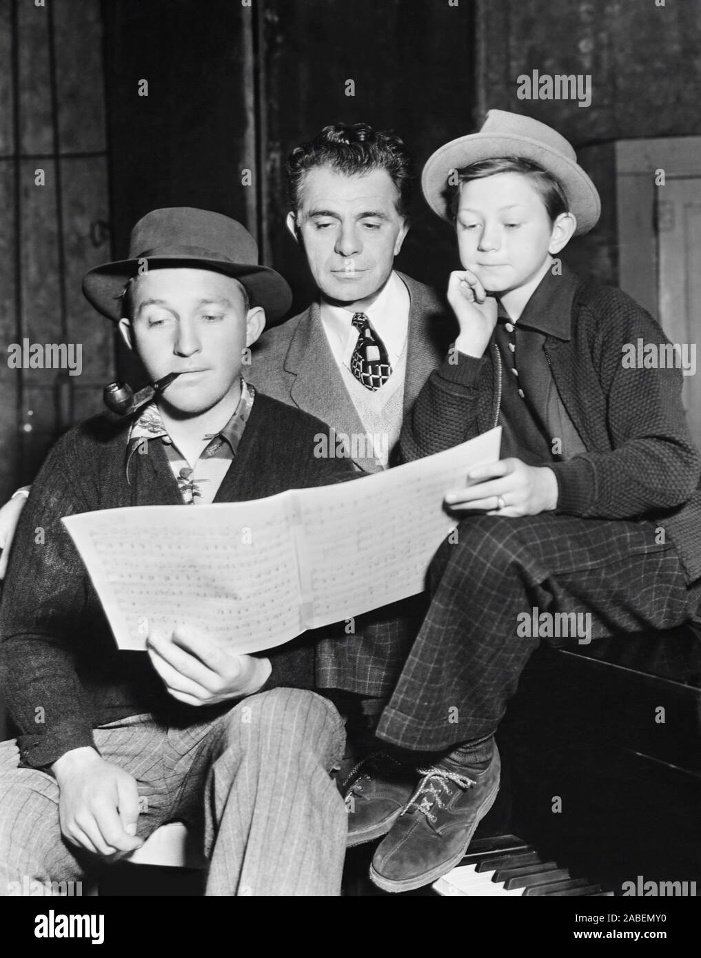 SING YOU SINNERS, from left: Bing Crosby, director Wesley Ruggles, Donald O'Connor on set, 1938 ...