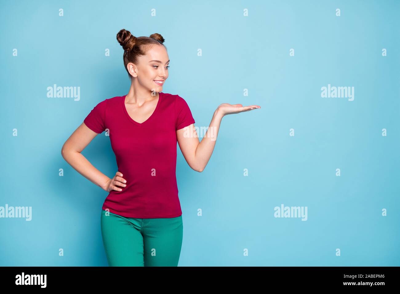 Photo of cheerful nice pretty cute girlfriend holding empty space with ...