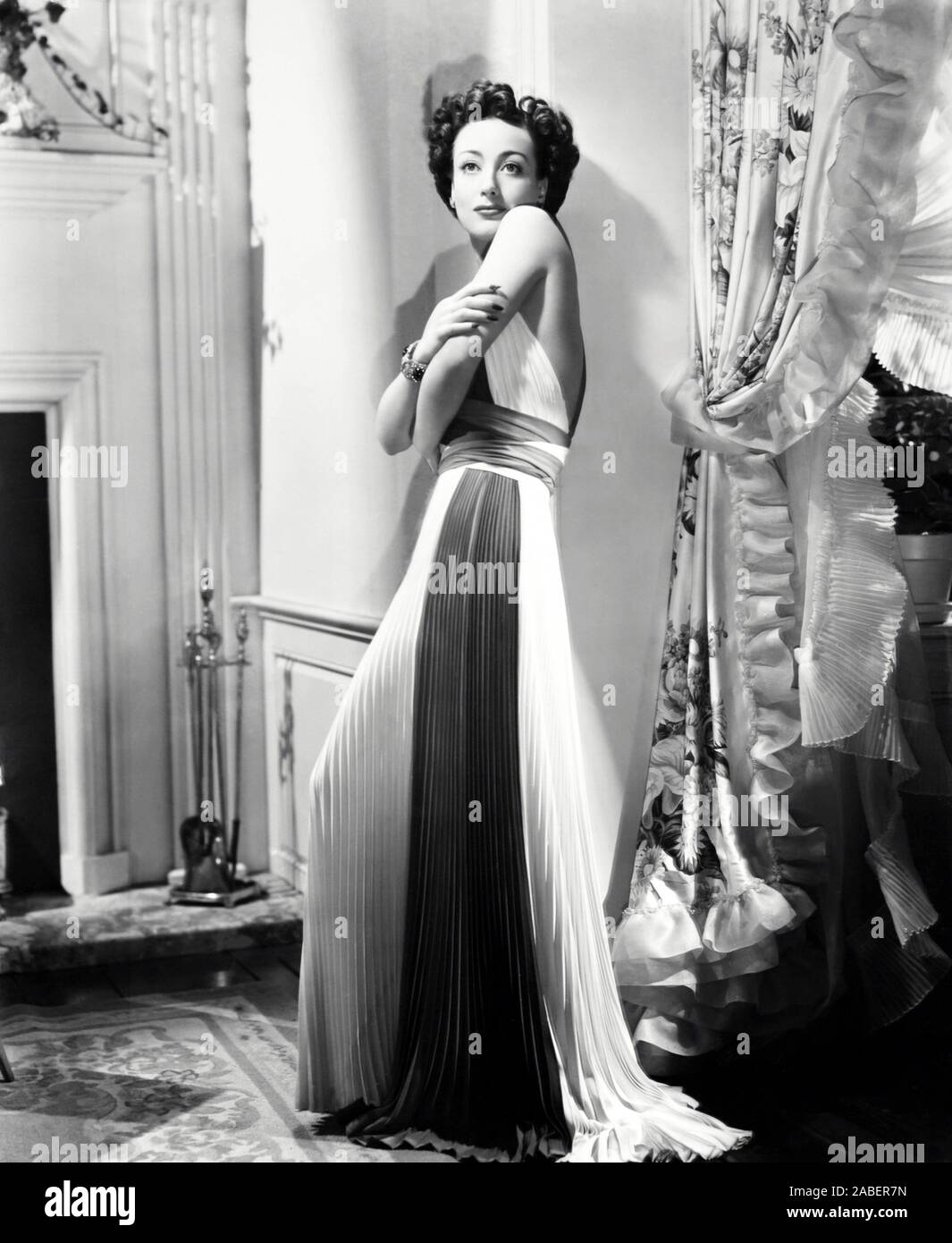 SUSAN AND GOD, Joan Crawford, in a gown by Adrian, 1940 Stock Photo - Alamy