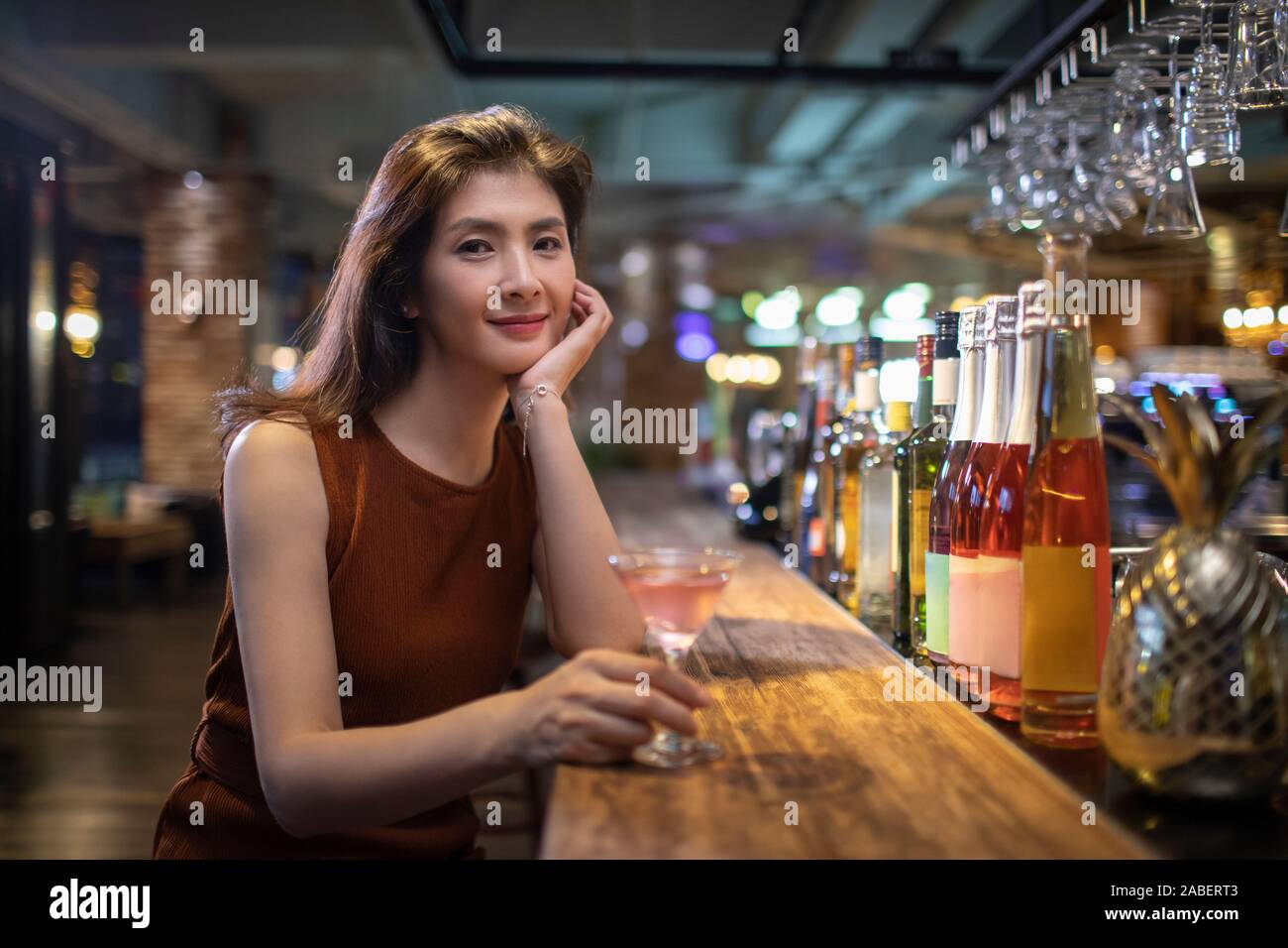 One mature woman bar hi-res stock photography and images - Alamy