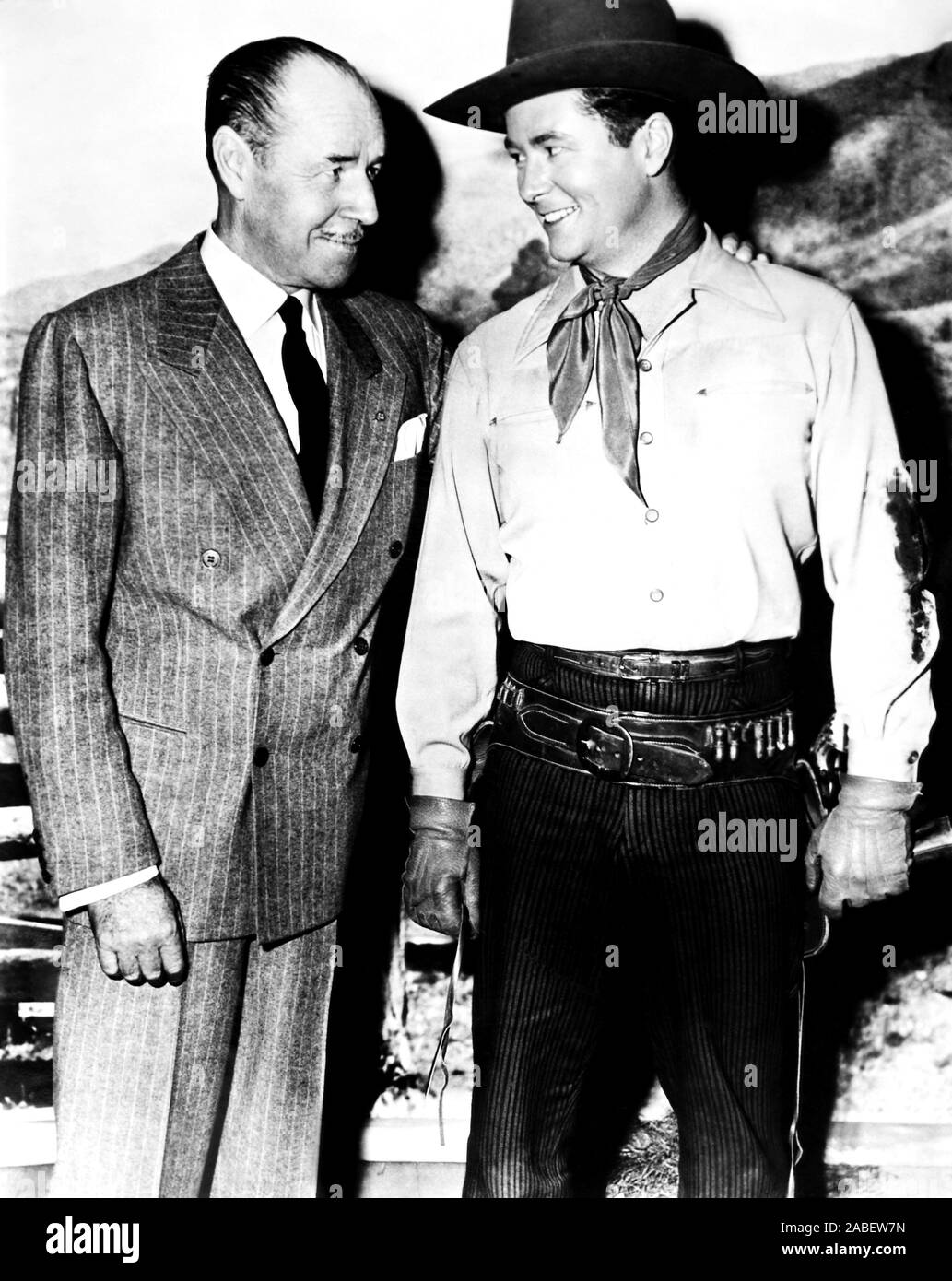 THUNDER MOUNTAIN, star Tim Holt, right, being visited on-set by his father, actor Jack Holt ...