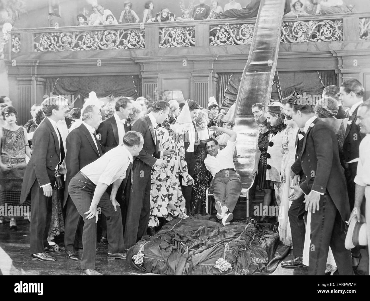 THREE WOMEN, director Ernst Lubitsch sliding down the chute on the film ...