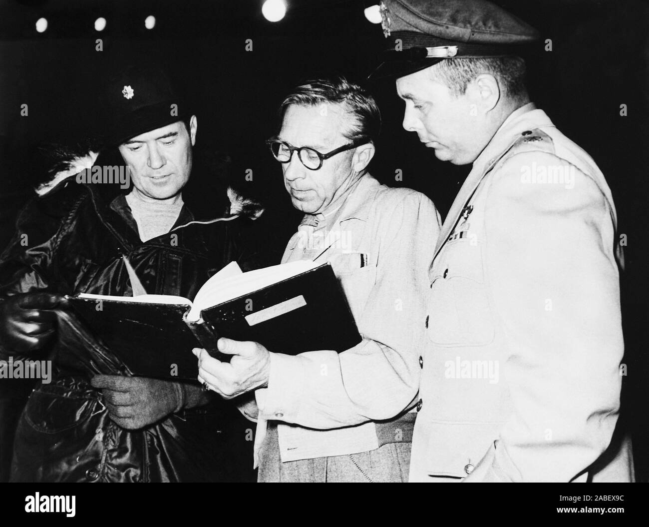 TOP OF THE WORLD, from left: Frank Lovejoy, director Lewis R. Foster on ...
