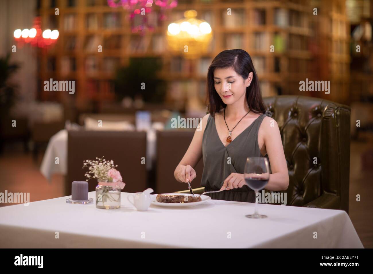 Woman eating steak hi-res stock photography and images - Alamy