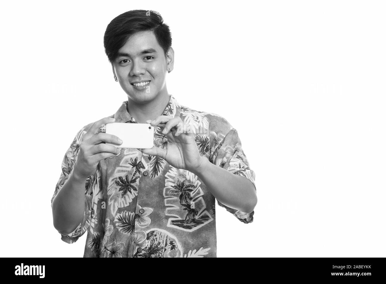 Asian holding camera man Black and White Stock Photos & Images - Alamy
