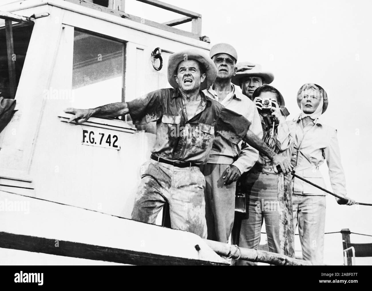 VOODOO ISLAND, from left, Elisha Cook, Jr., Boris Karloff, Murvyn Vye ...