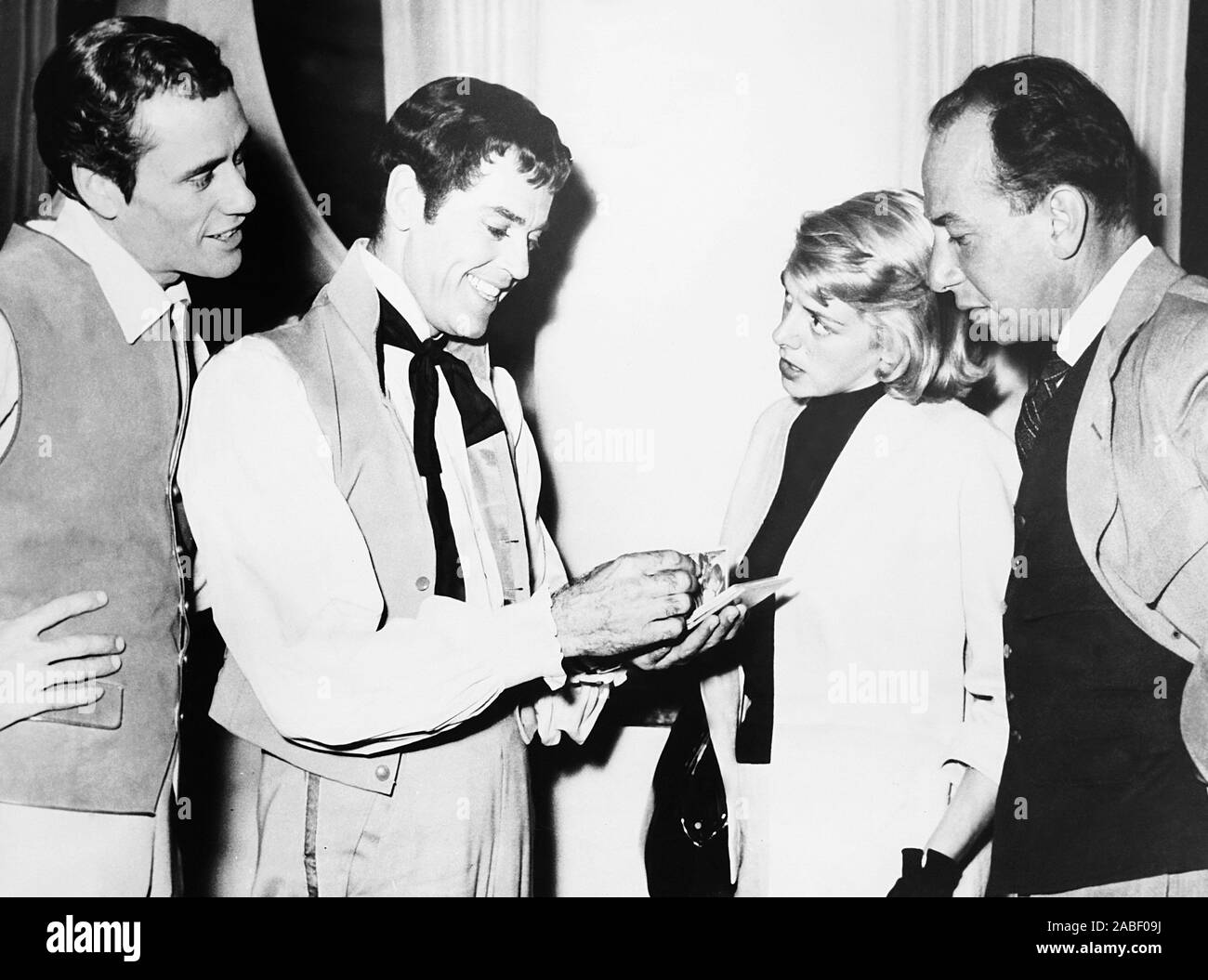 WAR AND PEACE, from left: Mel Ferrer, Henry Fonda look at the pictures ...