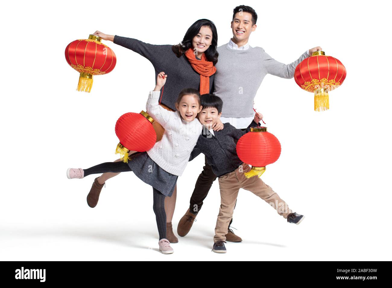 Happy young family holding lanterns Stock Photo - Alamy