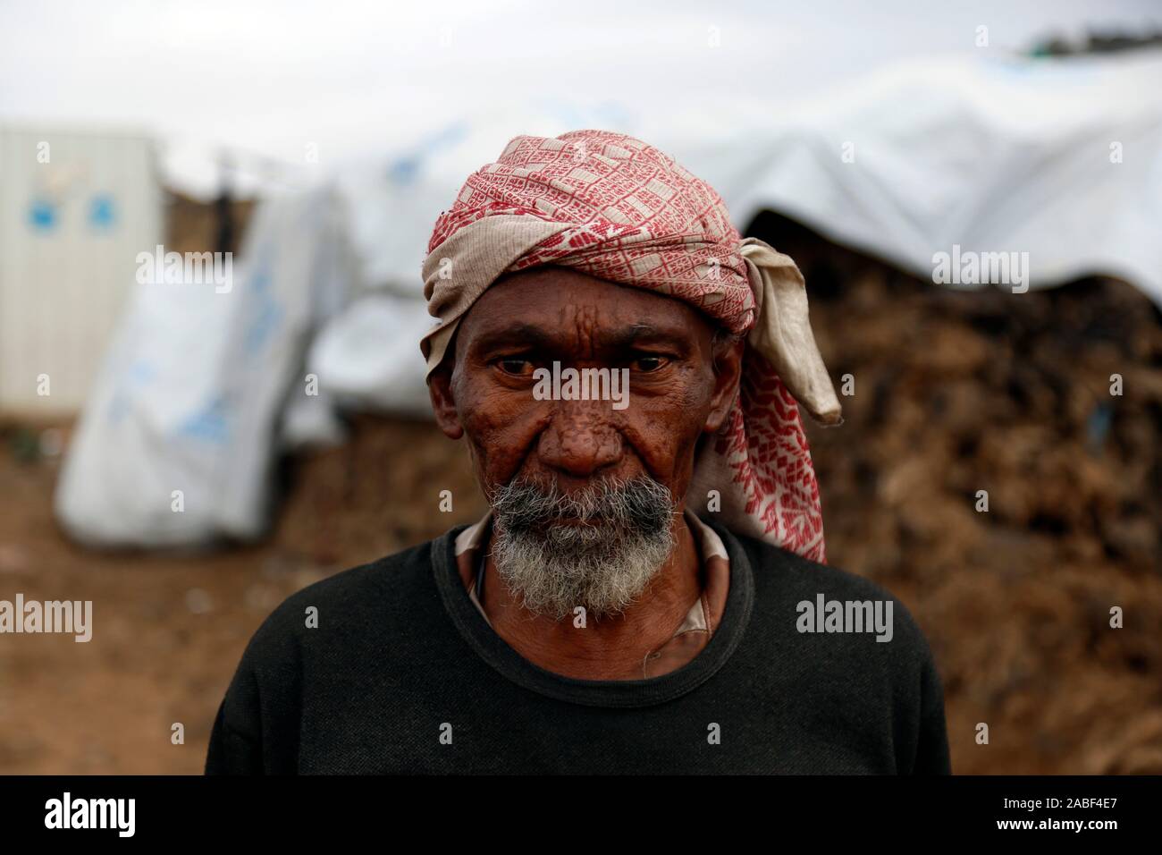 Sanaa, Yemen. 26th Nov, 2019. A Yemeni displaced man stands at a camp ...