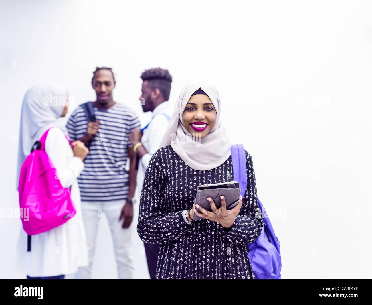 young african modern muslim female student using tablet computer with ...