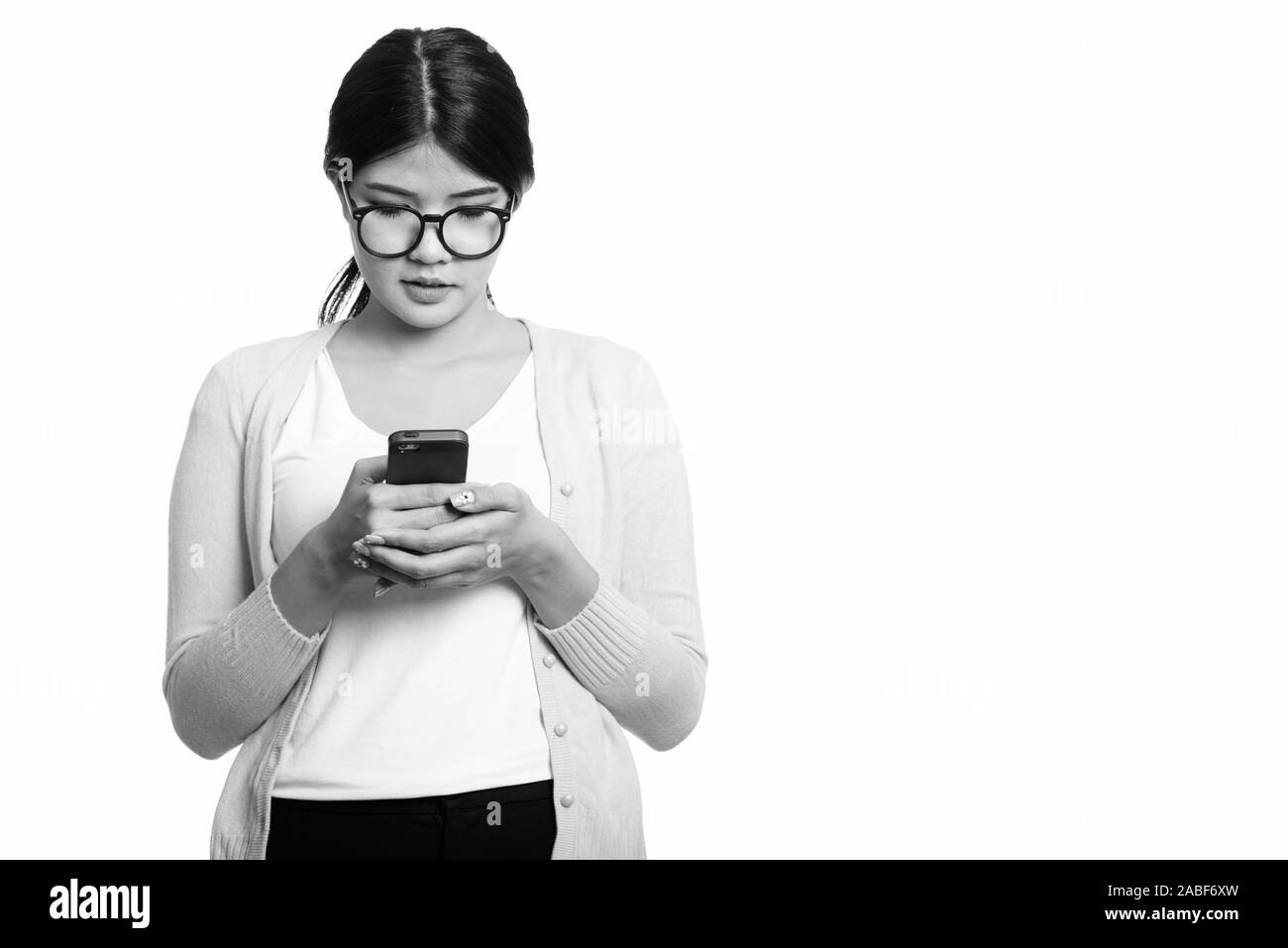 Beautiful asian woman using Black and White Stock Photos & Images - Alamy