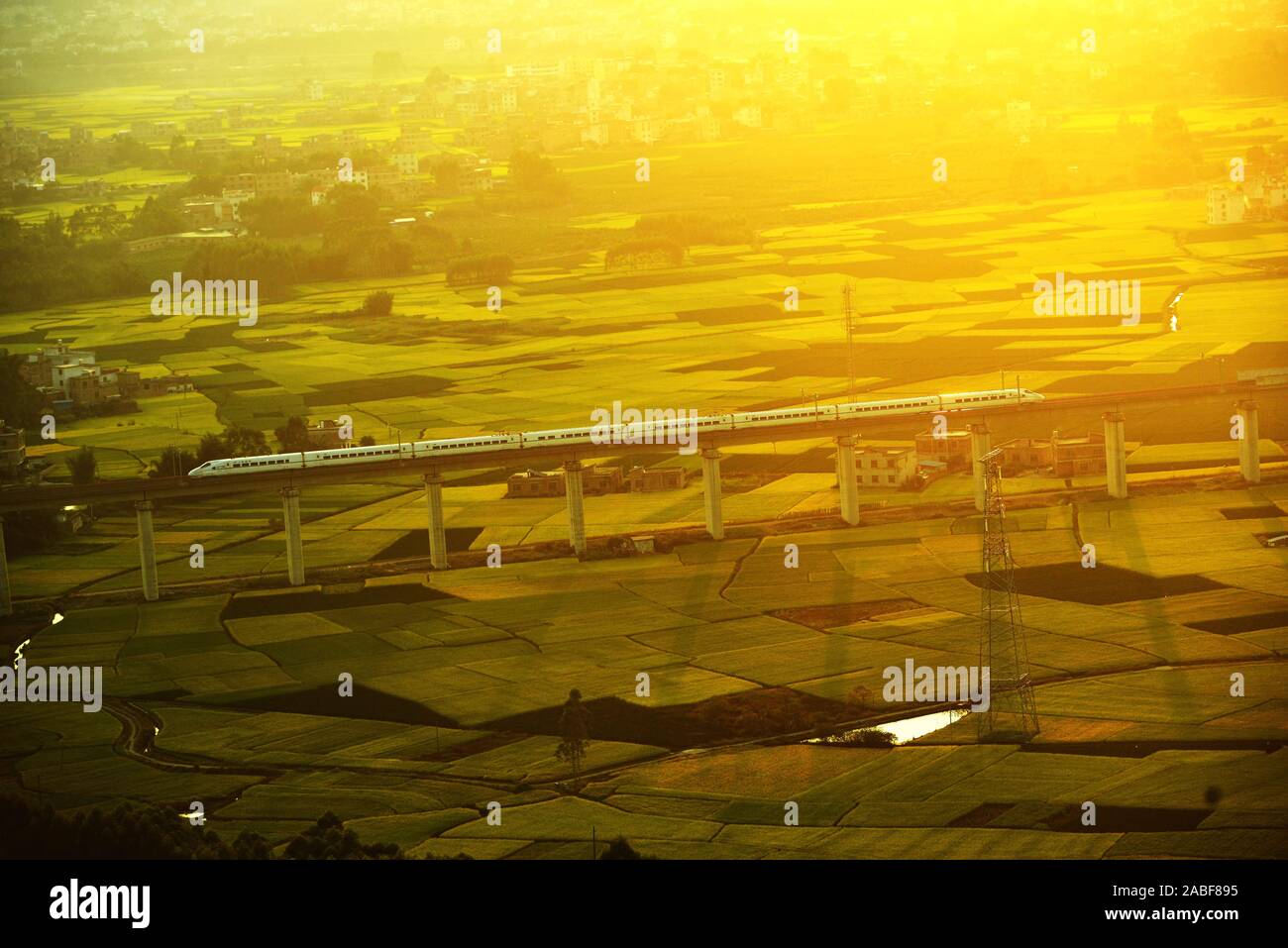 An aerial view of a high-speed train running among 150 thousand acres ...