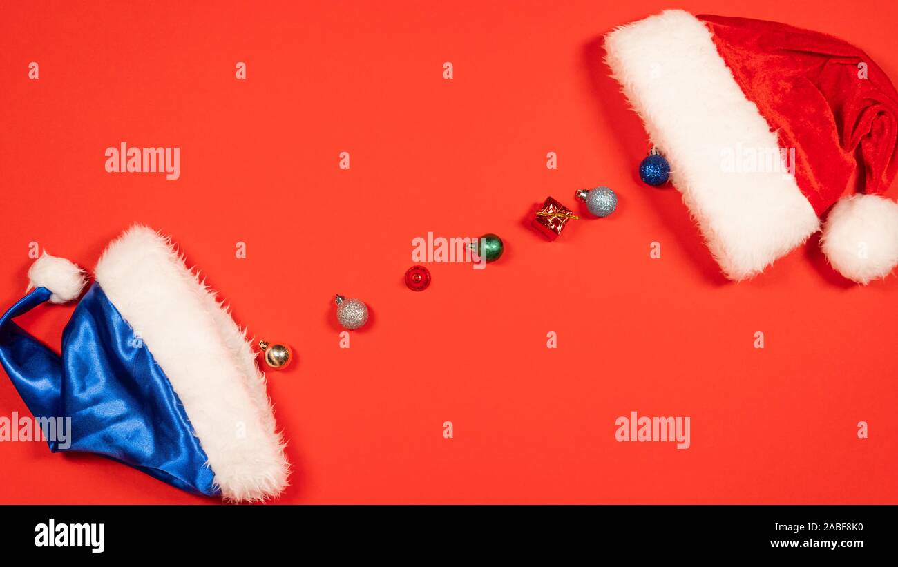 New Years balls and Santa Claus hat. Flat lay of Christmas balls and ...