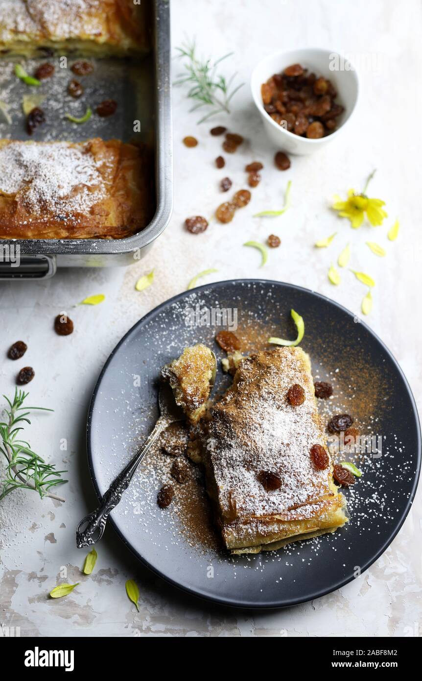 Concept of Greek cuisine. Homemade traditional greek Bougatsa, phyllo ...