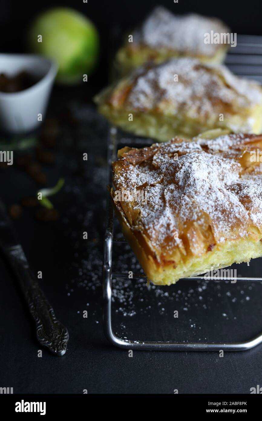 Concept of Greek cuisine. Homemade traditional greek Bougatsa, phyllo ...