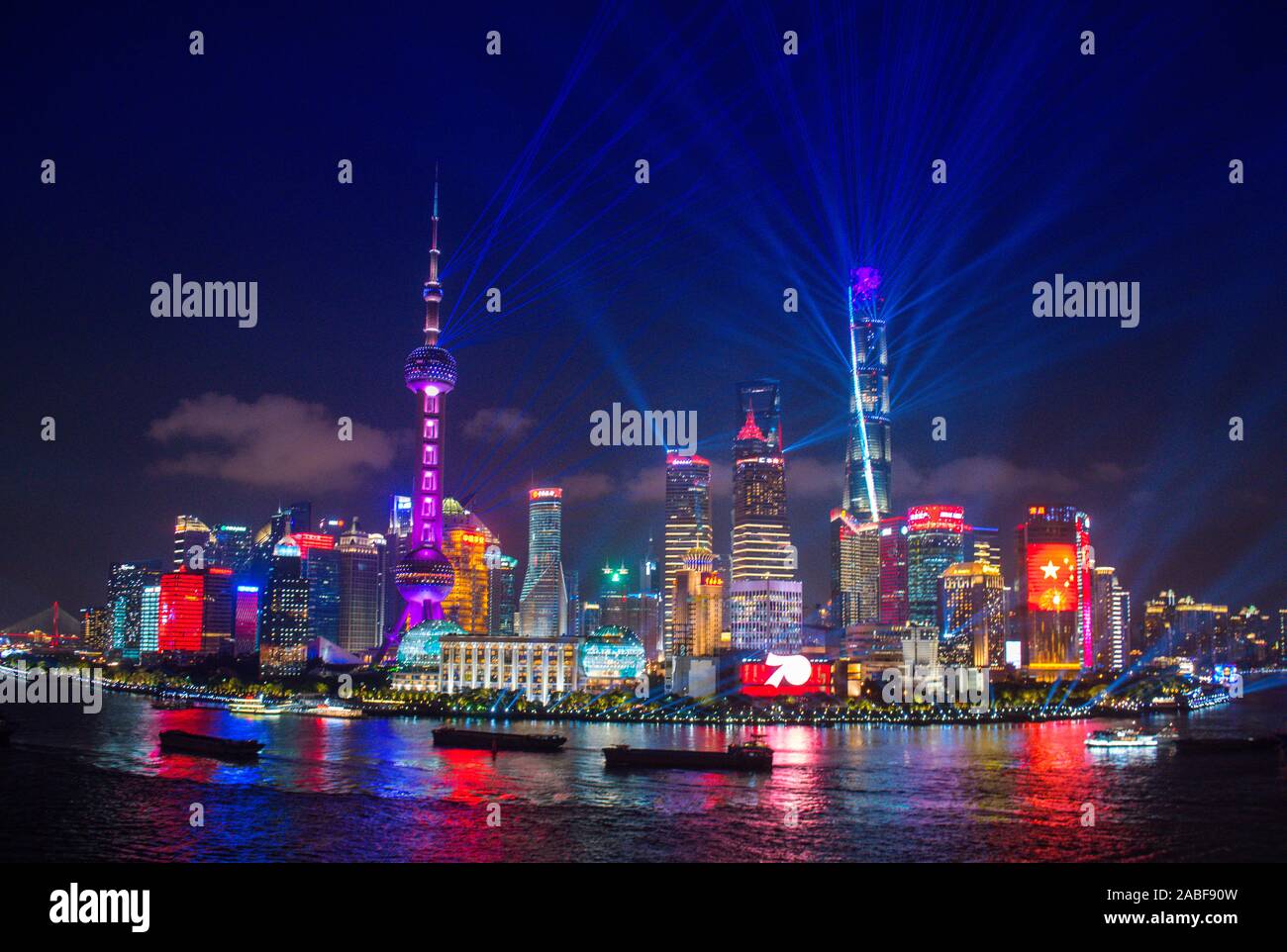 A grand light show is performed at the Bund with local landmarks as ...