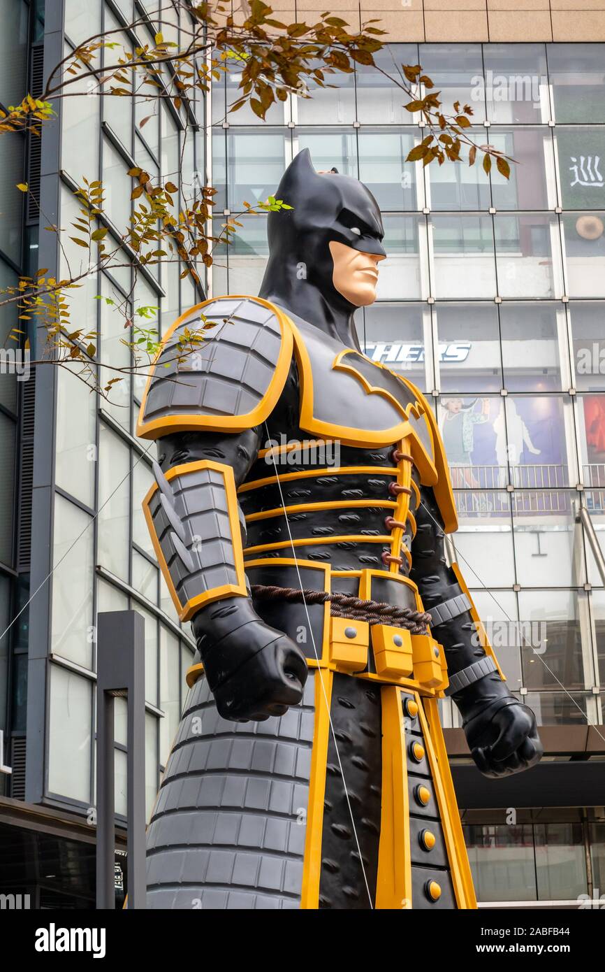 An eight-meter-high sculpture of fictional superhero Batman appears to ...