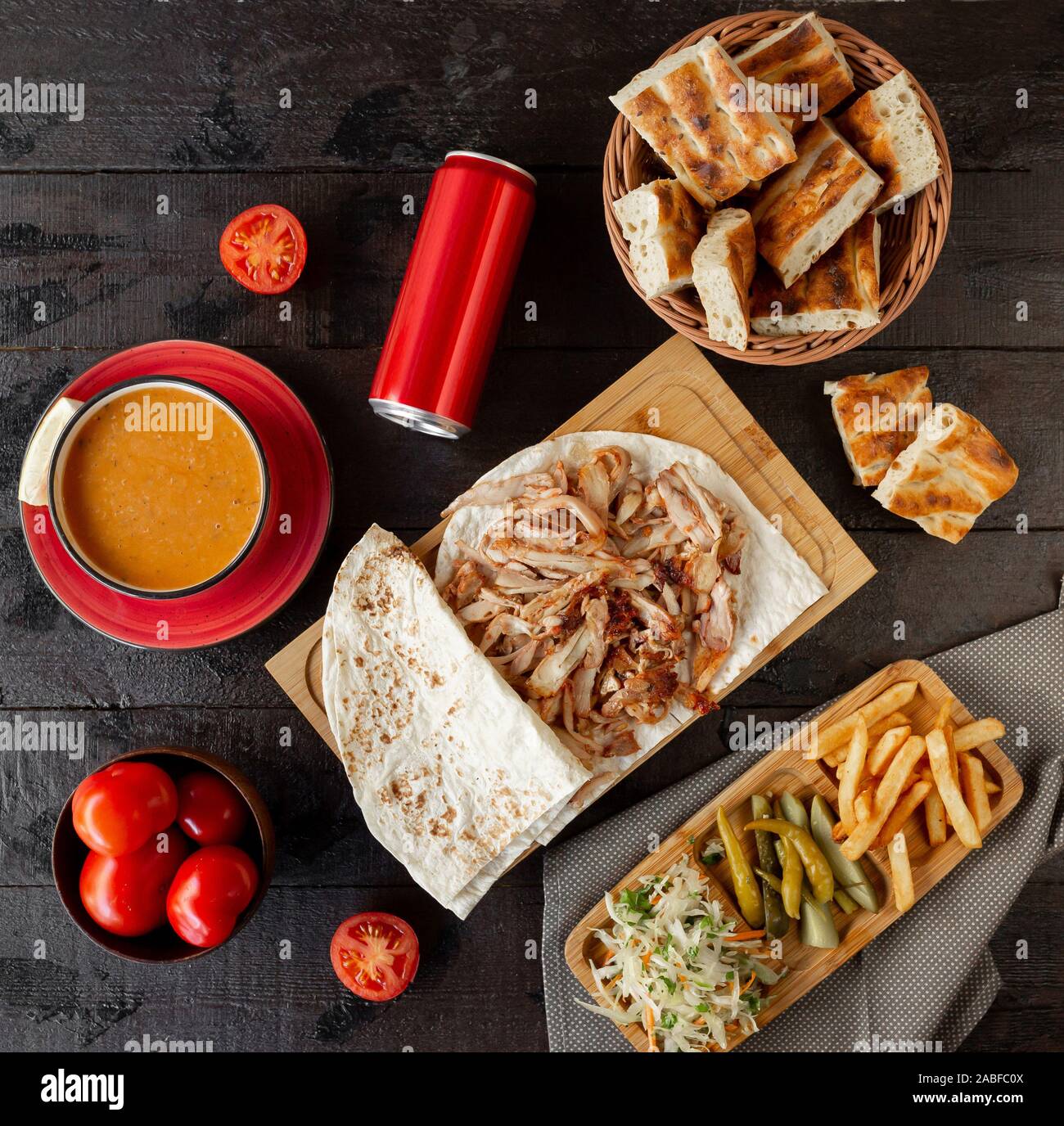 chicken doner slices on flatbread, served with lentil soup and side ...