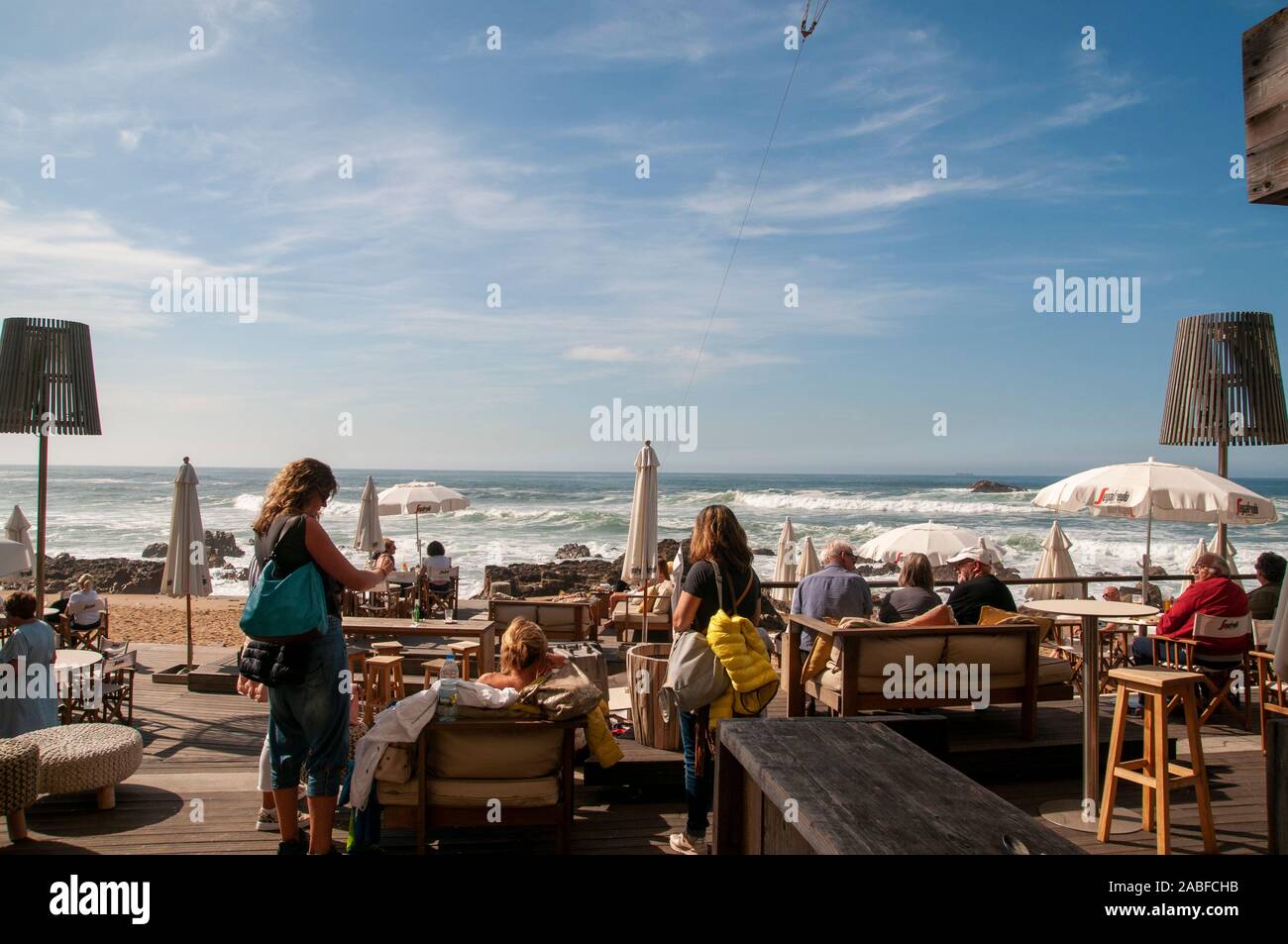 Open air cafe on the Atlantic Ocean photographed at the Douro River ...