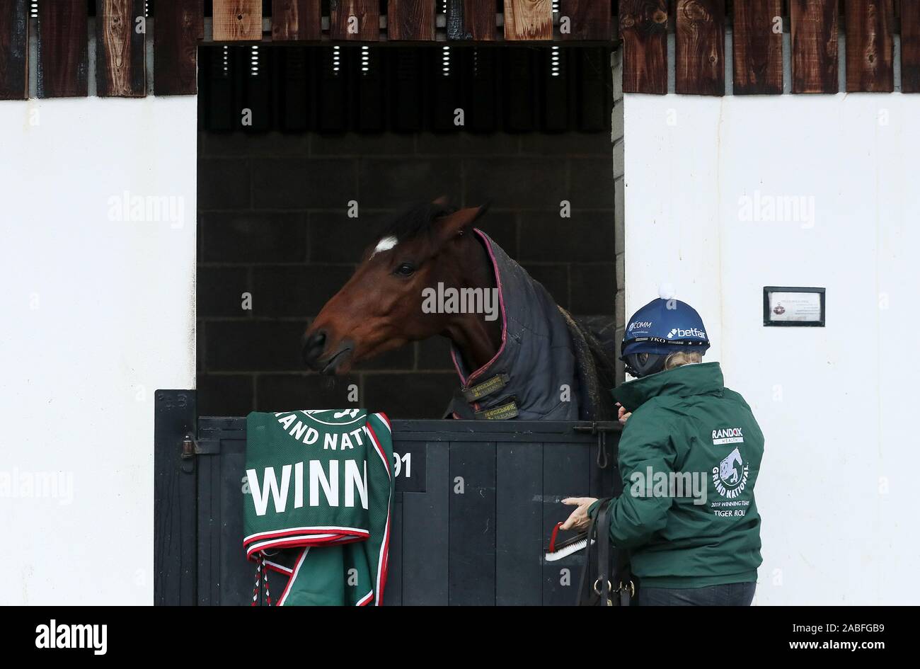 Two time Grand National winner Tiger Roll with groom Louise Magee ...