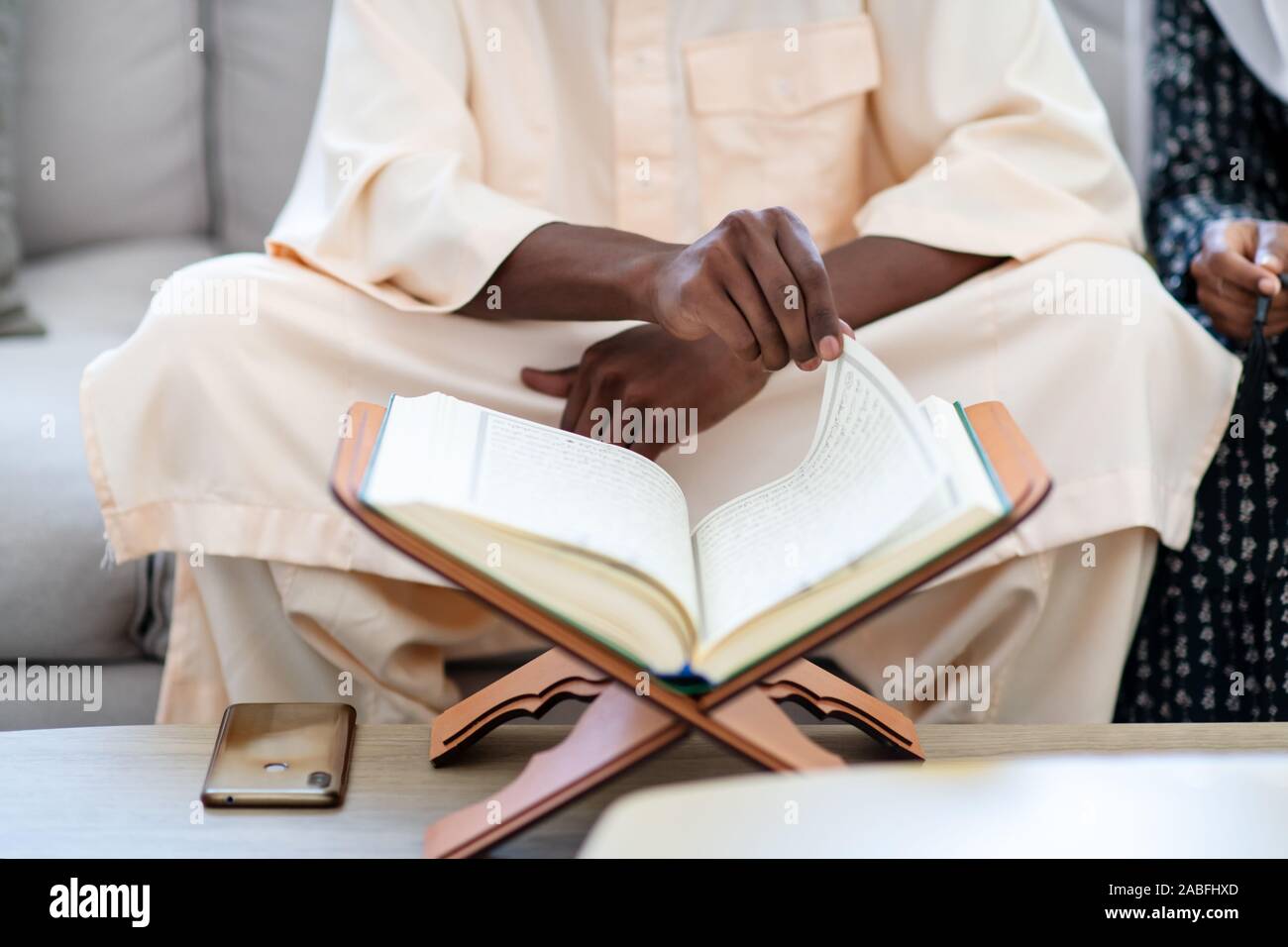 african muslim couple at home in ramadan reading quran holly islam book ...