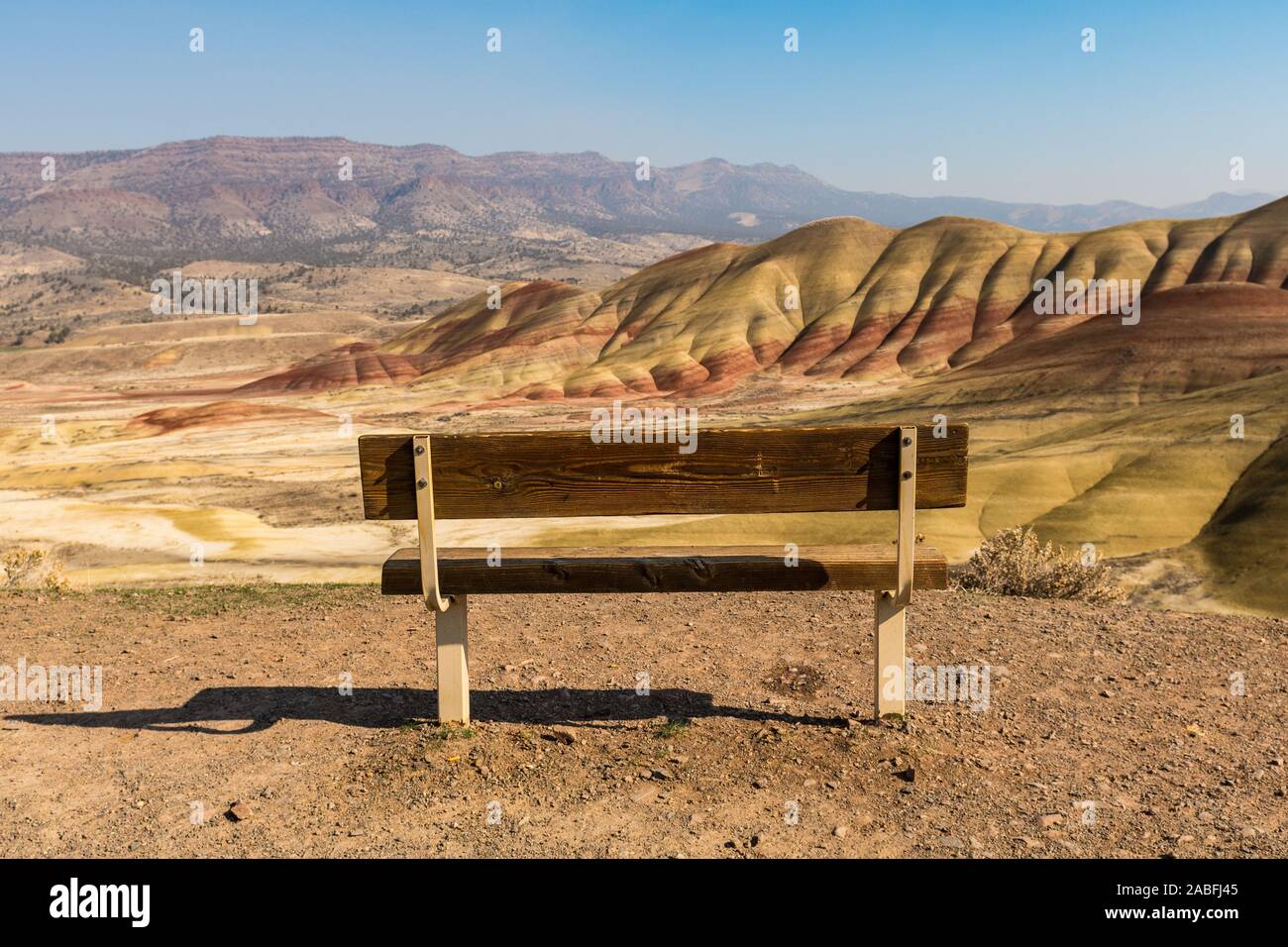 Detail of a bench facing the colorful landscape in Painted Hills ...