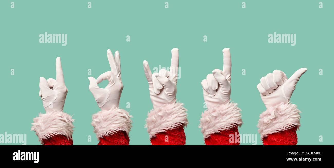 Five Santa's hands in white gloves on blank blue background. Christmas ...