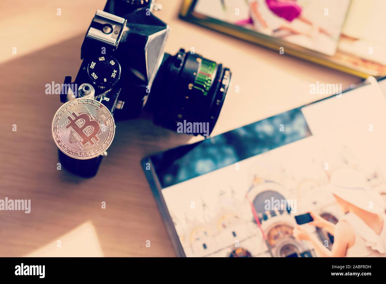 Bitcoin and camera with close up view Album with photos of travel and ...