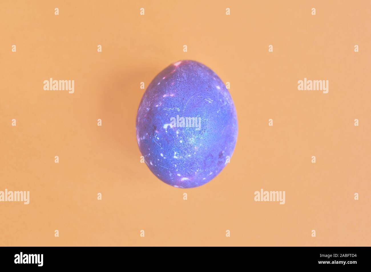 Cosmic galactic Easter egg on yellow pastel background Stock Photo - Alamy