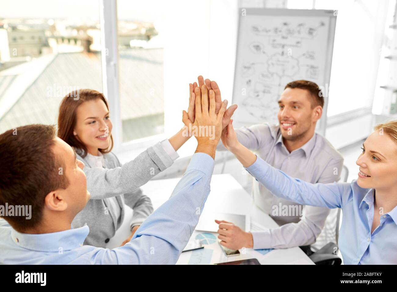 happy business team making high five at office Stock Photo - Alamy