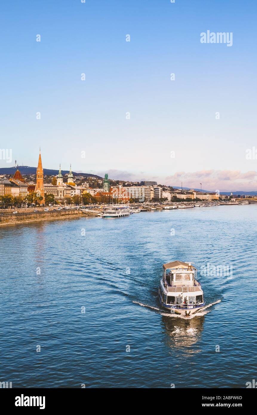Danube river in Budapest, Hungary with floating sightseeing boat on the ...