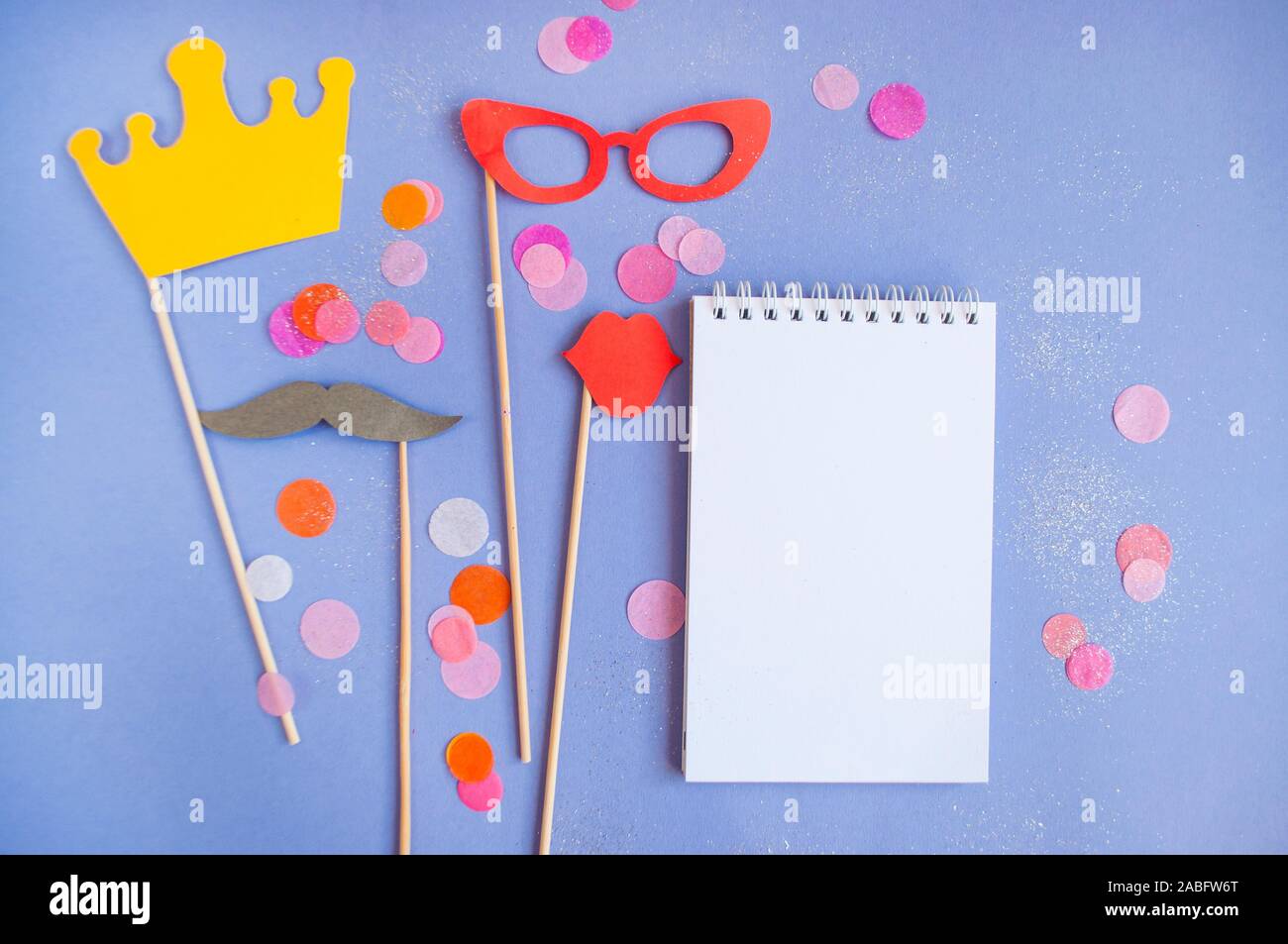 Colorful photo booth props crown, moustaches, glasses and lips on ...