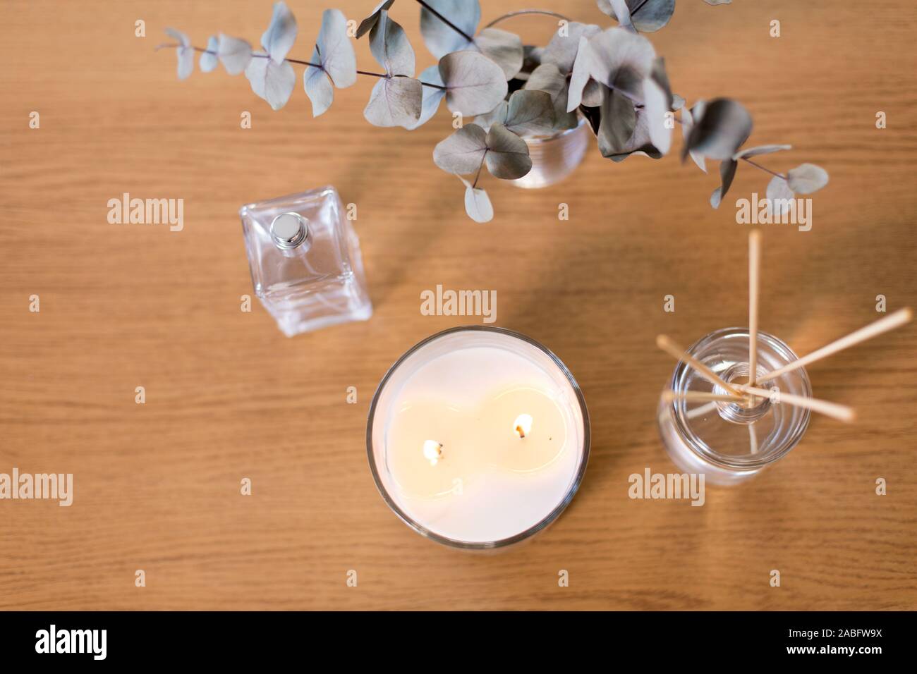 aroma reed diffuser, burning candle and perfume Stock Photo - Alamy