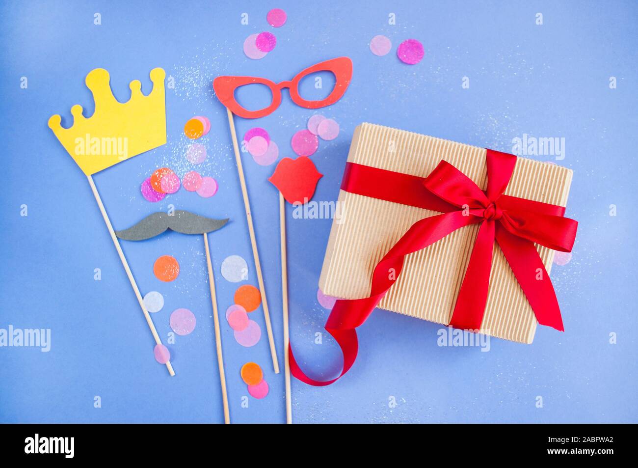 Colorful photo booth props crown, moustaches, glasses and lips on ...